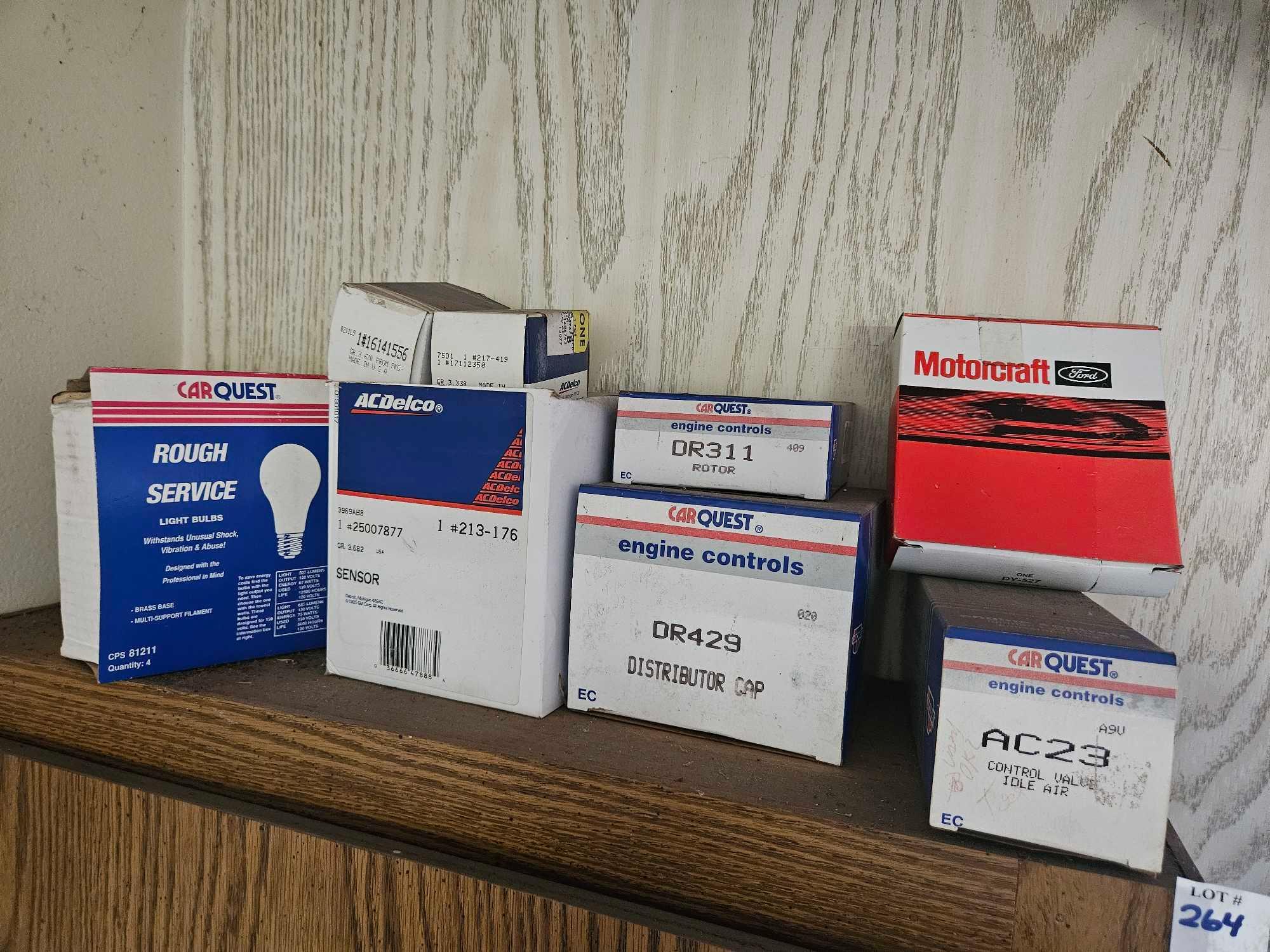 Top of garage cabinet - engine parts in boxes. | Proxibid