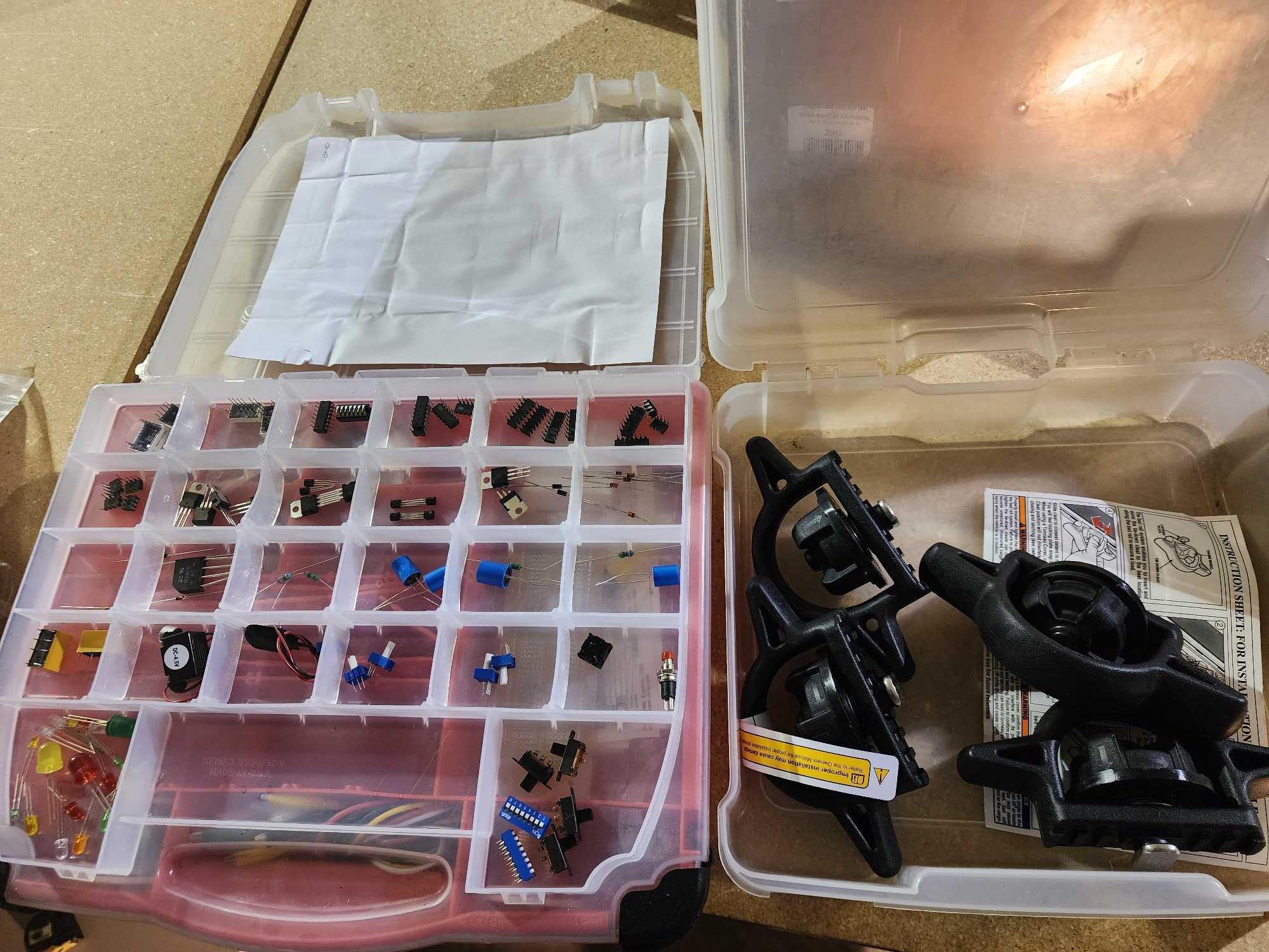 Two plastic containers. One Plano with electronic | Proxibid