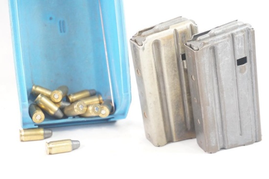 Two metal Colt 10 round AR-15 magazines. Used. And 12 rounds of 45 ACP ...