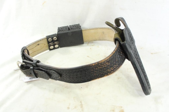One black leather basket weave tooled pistol belt, tooled leather right ...
