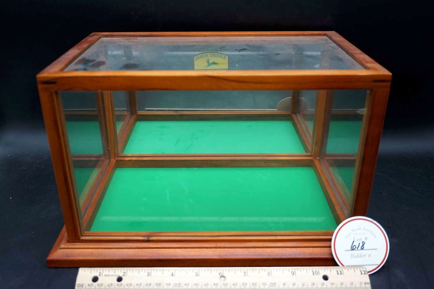 Glass Display case with John Deere logo | Proxibid