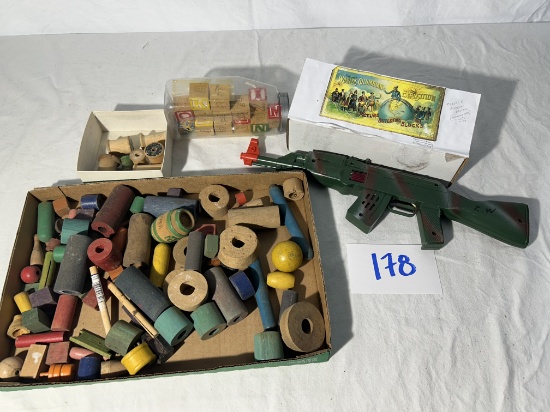 Vintage colored wood blocks; wood sewing spools and plastic gun | Art ...