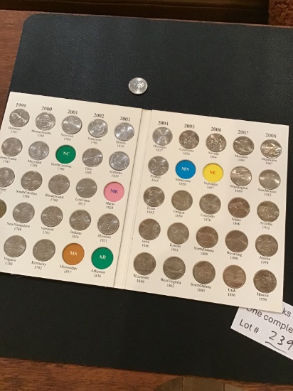Two books of collectible US quarters | Online Auctions | Proxibid