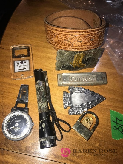 belt buckles-flashlight-can opener-harmonica | Online Auctions | Proxibid