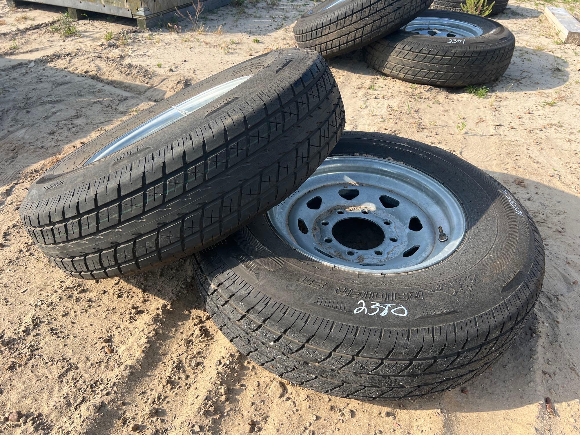 (2) 235/80R16 TIRES W/ 8 LUG GALVANIZED RIMS | Proxibid