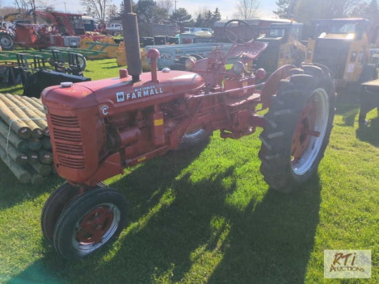 Farmall Super C tractor, narrow front end, has rear wheel weights ...