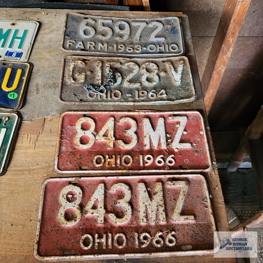 Four Ohio license plates including 1963 farm | Proxibid