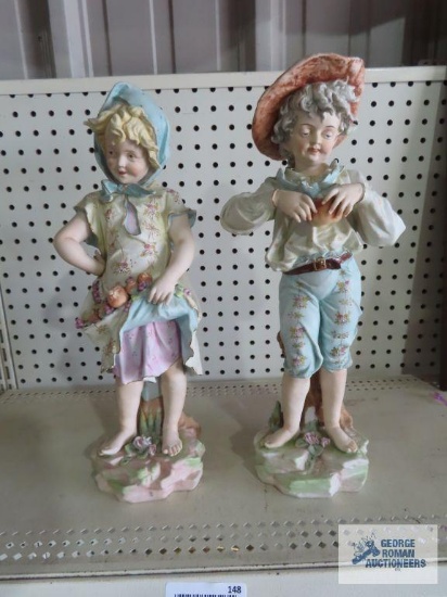 Boy and girl ceramic figurines. Both have Arrow markings on bottom ...