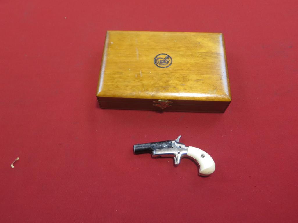 Colt .22short derringer with wooden display | Proxibid