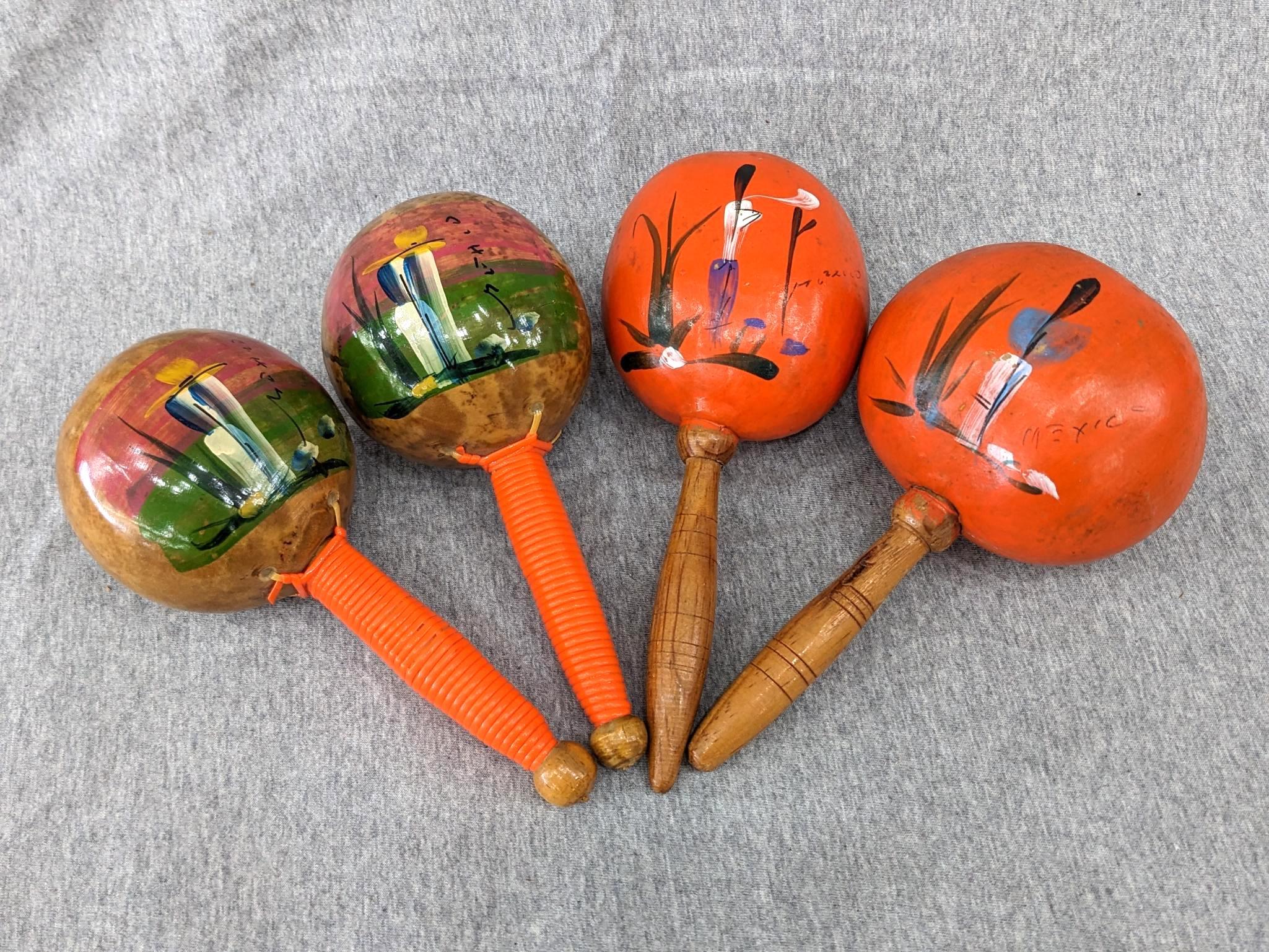 Tow sets of maraca's; largest measures 8" long. | Proxibid
