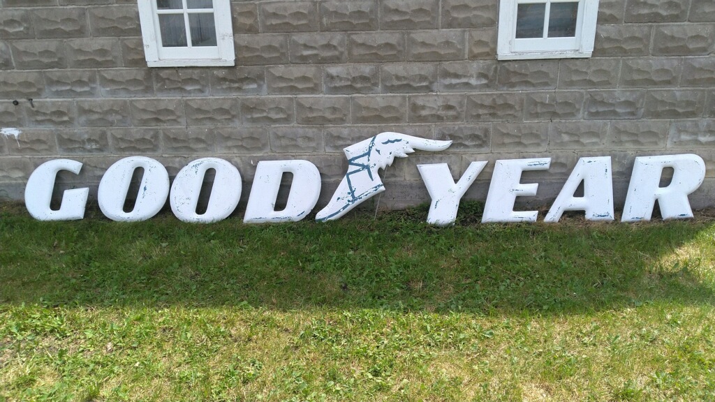 VINTAGE GOODYEAR WING FOOT SIGN, 18"-20" TALL | Proxibid
