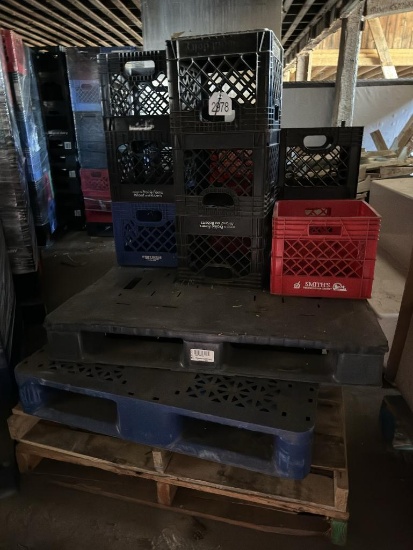 Pallet with wood pallet, 2 plastic pallets and 13 plastic milk crates ...