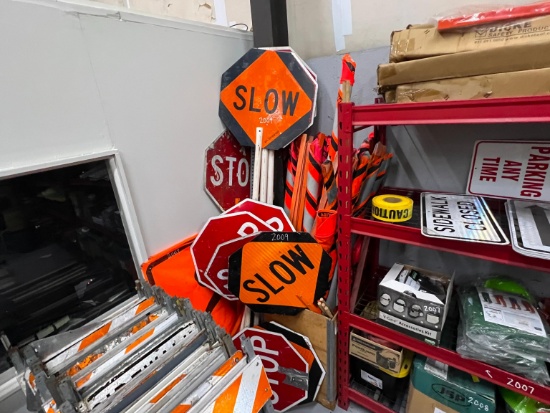TRAFFIC CONTROL SIGNS IN CORNER, STOP SIGNS, FLAGGER SIGNS, MEN AT WORK ...