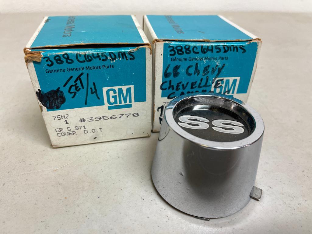 Two Boxes of OEM GM Set of Four SS Center Caps | Proxibid