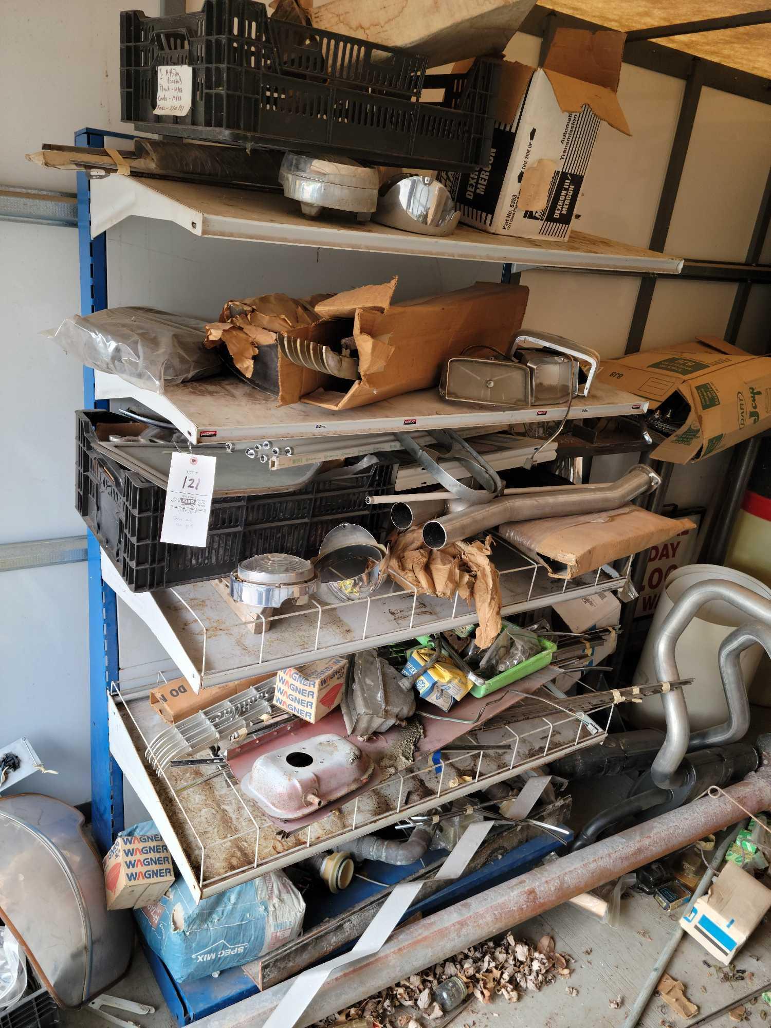Shelf with car parts, cadillac parts | Proxibid