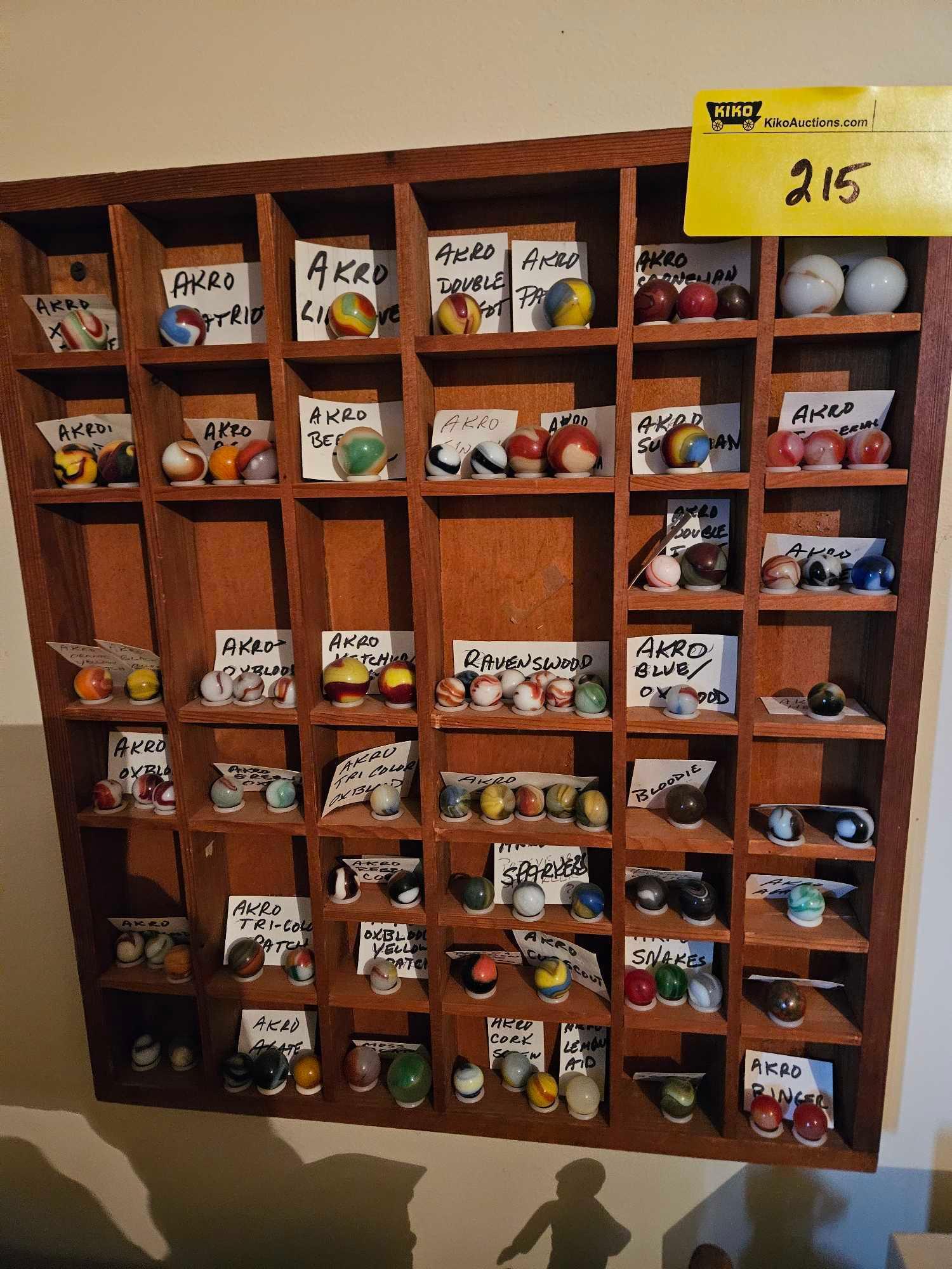 Shadow box with early marbles, mostly Akro | Proxibid