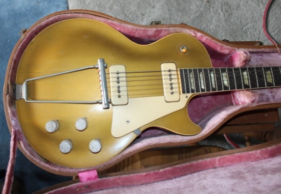 Kiko Auctioneers Auction Catalog - '53 Les Paul, Ant. Showcase, More ...